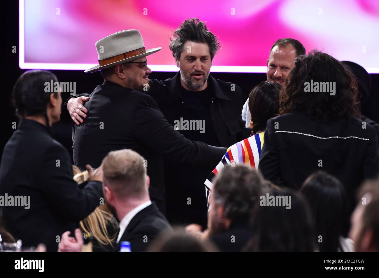 Sterlin Harjo, left, and Garrett Basch in the audience at the 37th Film ...