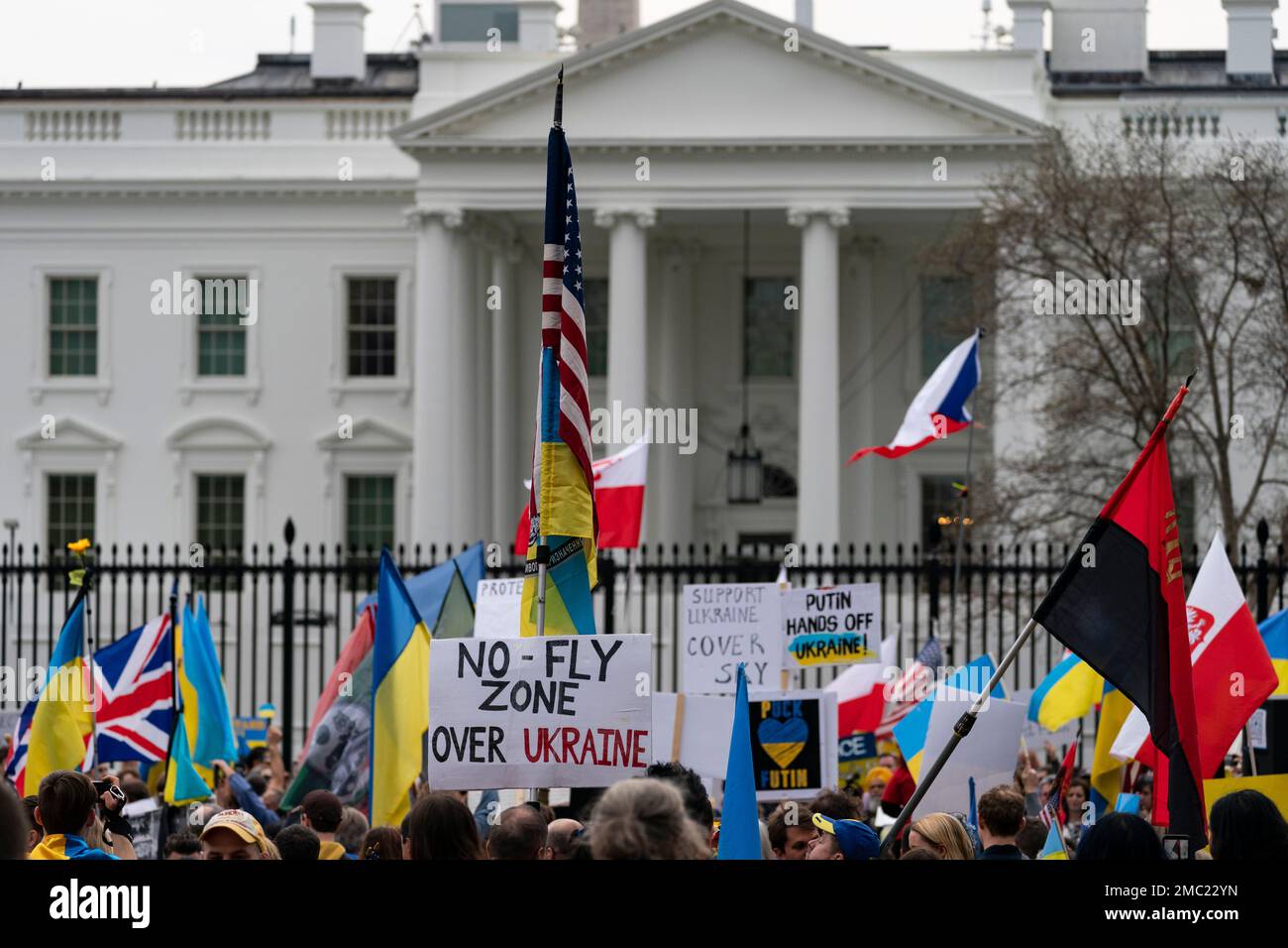 People protest the Russian invasion of Ukraine during a rally outside ...