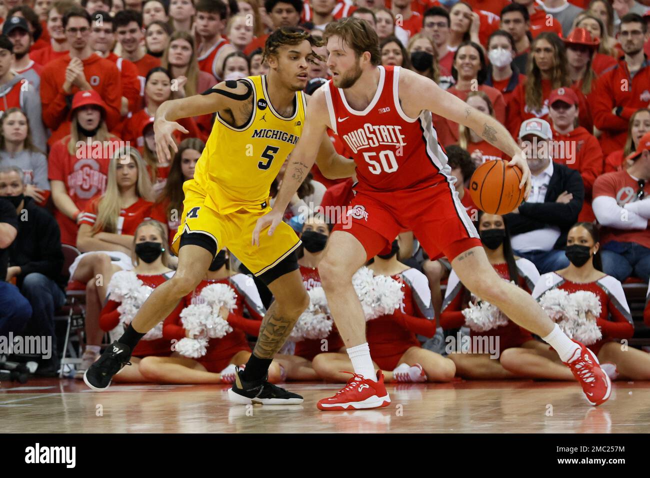 Ohio State's Joey Brunk, right, posts up against Michigan's Terrance ...
