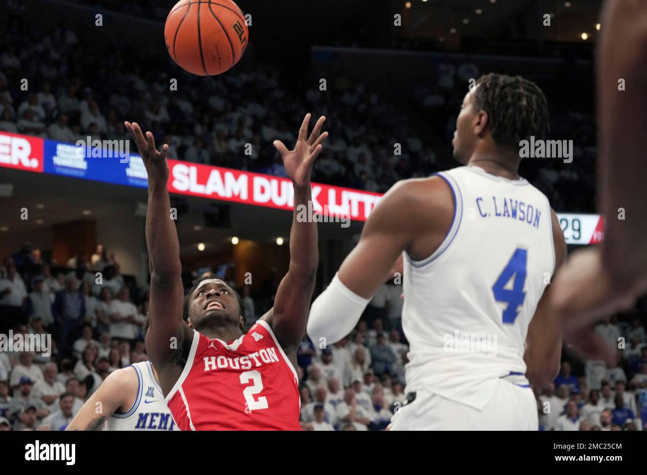 Houston's Robbie Armbrester (2) tries to gain control of the ball as ...