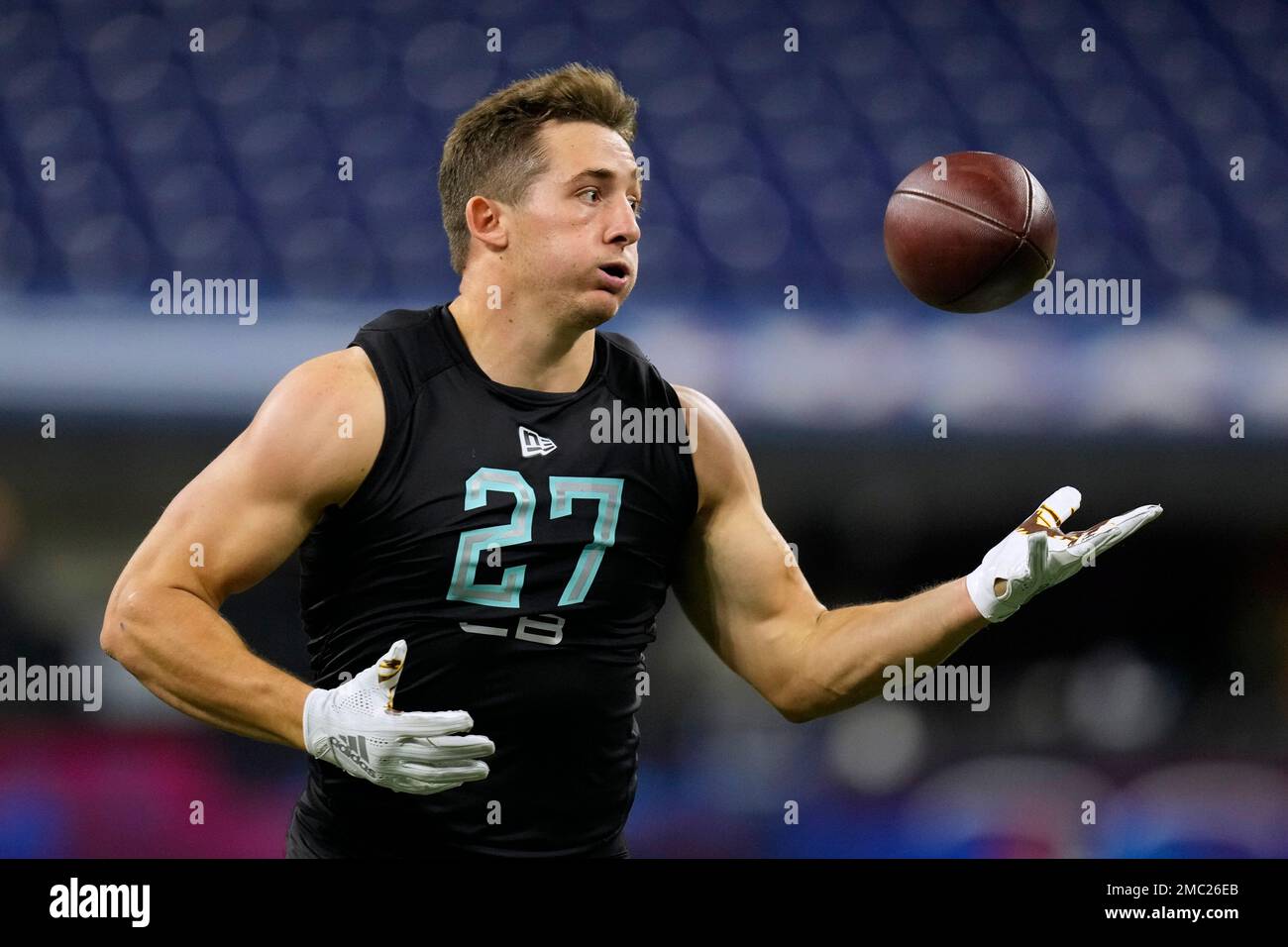 Wyoming linebacker Chad Muma runs a drill at the NFL football scouting ...