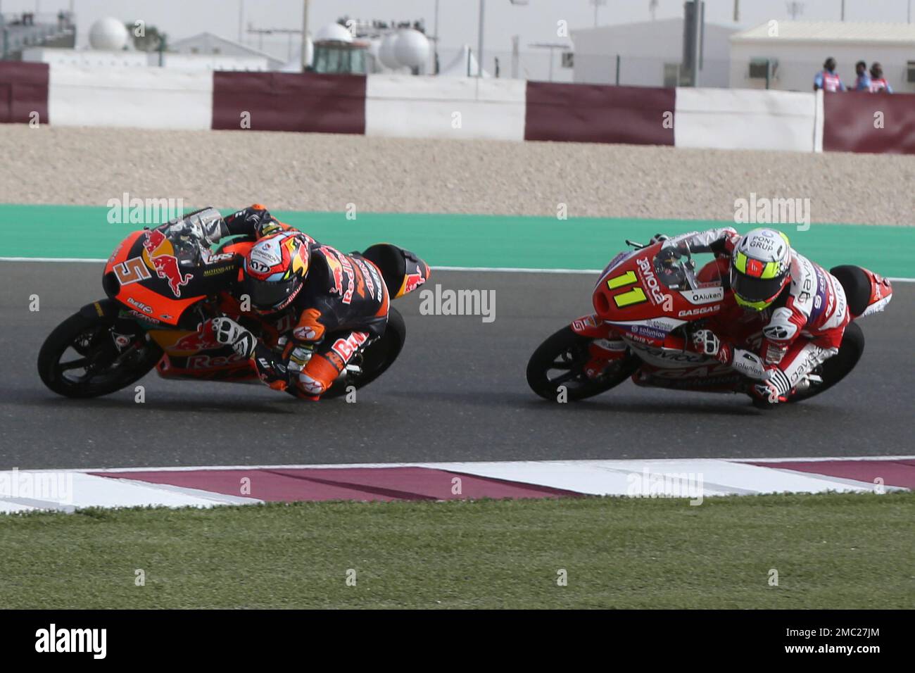 Spain's rider Jaume Masia of the Red Bull KTM Ajo, left, and Spain's ...