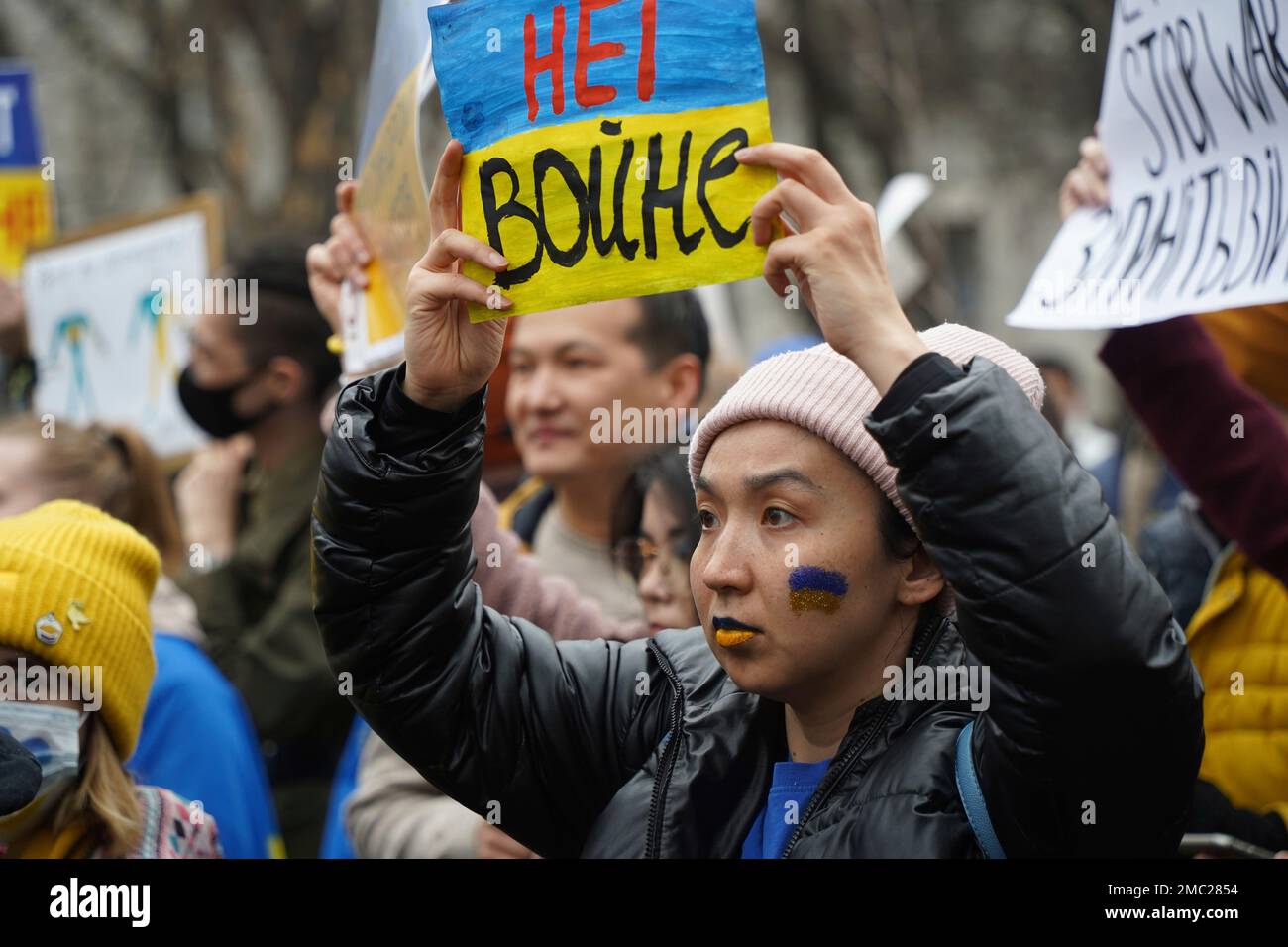 Demonstrators with posters reading "No war!" gather to protest against ...