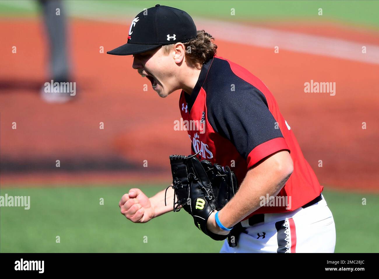 Cincinnati pitcher Garrett Harker (35) celebrates after pitching a ...