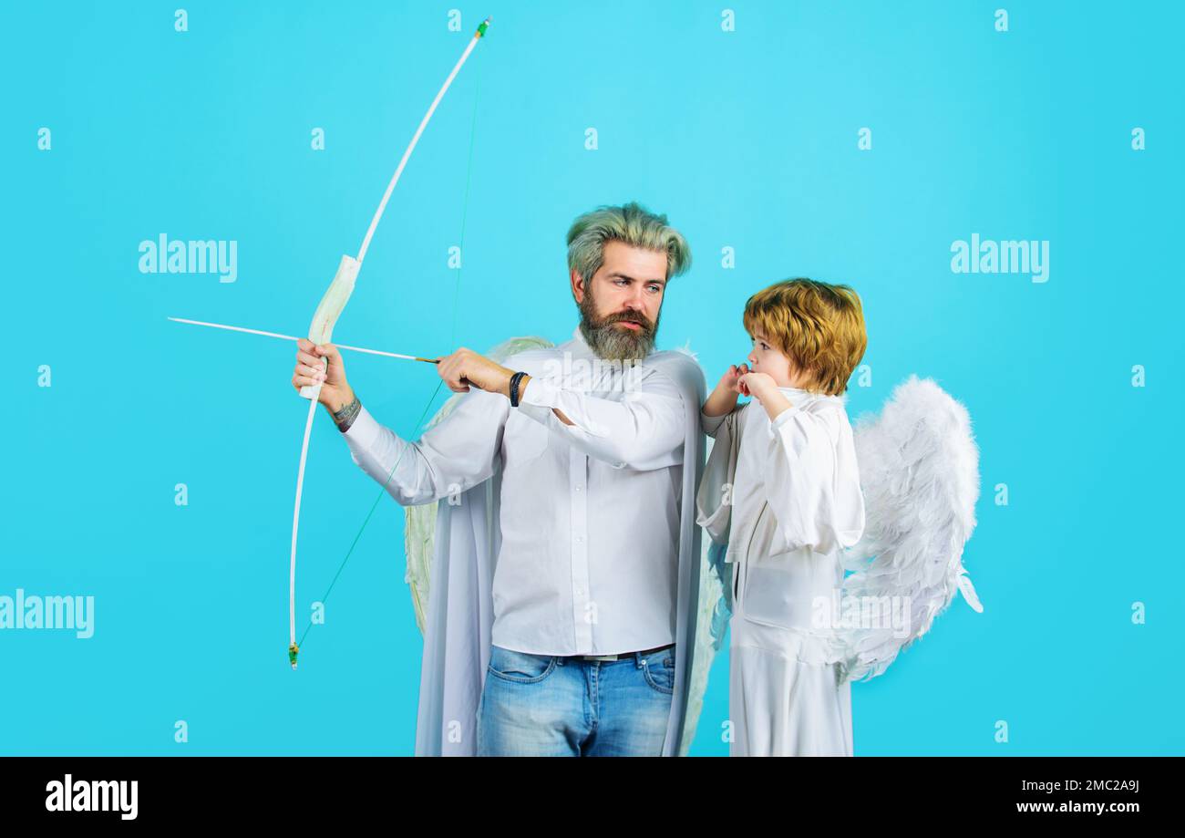 Valentines angels. Little cupid boy and father in angelic wings with ...