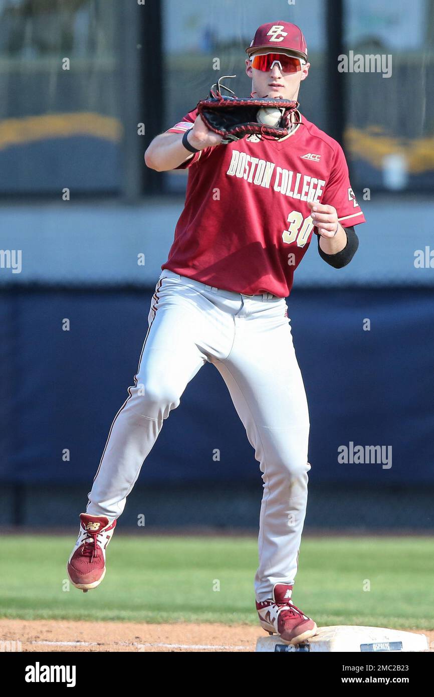 Boston College first baseman Joe Vetrano (30) gloves a thrown ball for ...