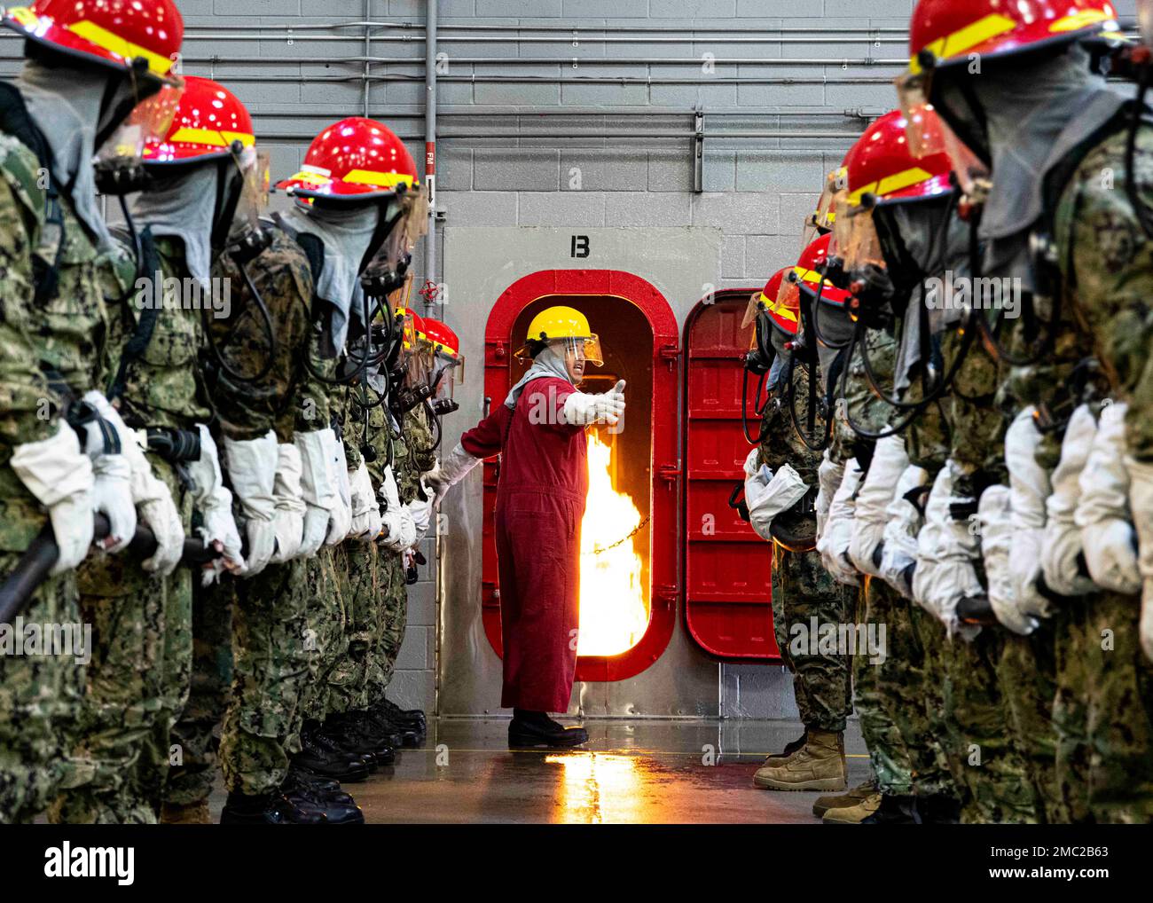 220623-N-PW480-0376 Damage Controlman 2nd Class Aaron Conner, a ...