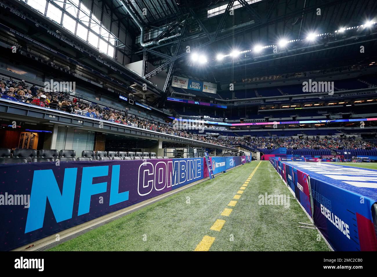 Fans watch on field drills from the stands at the NFL football scouting ...