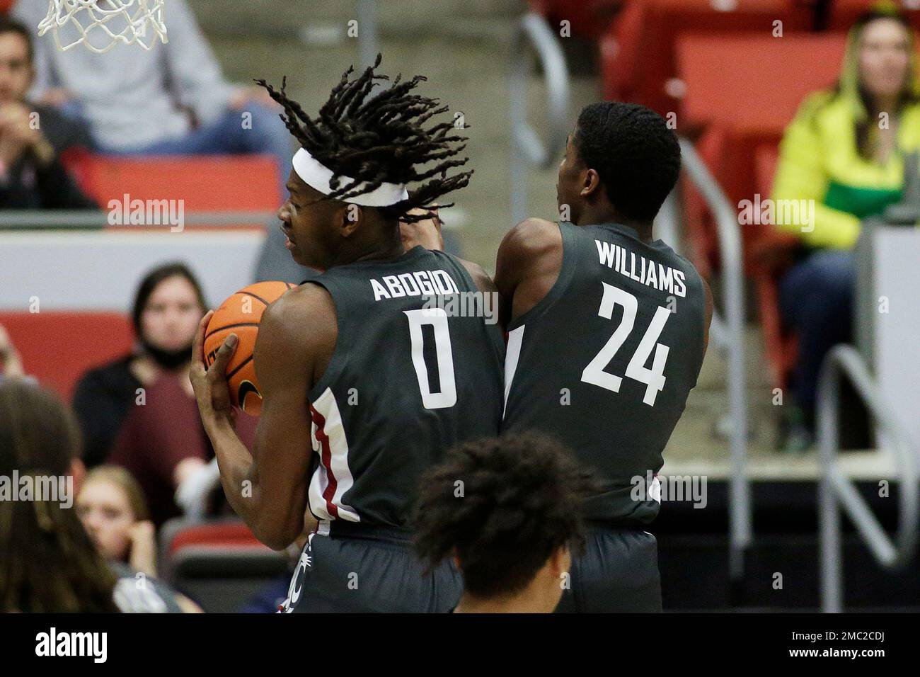 Washington State forward Efe Abogidi (0) grabs a rebound next to guard ...