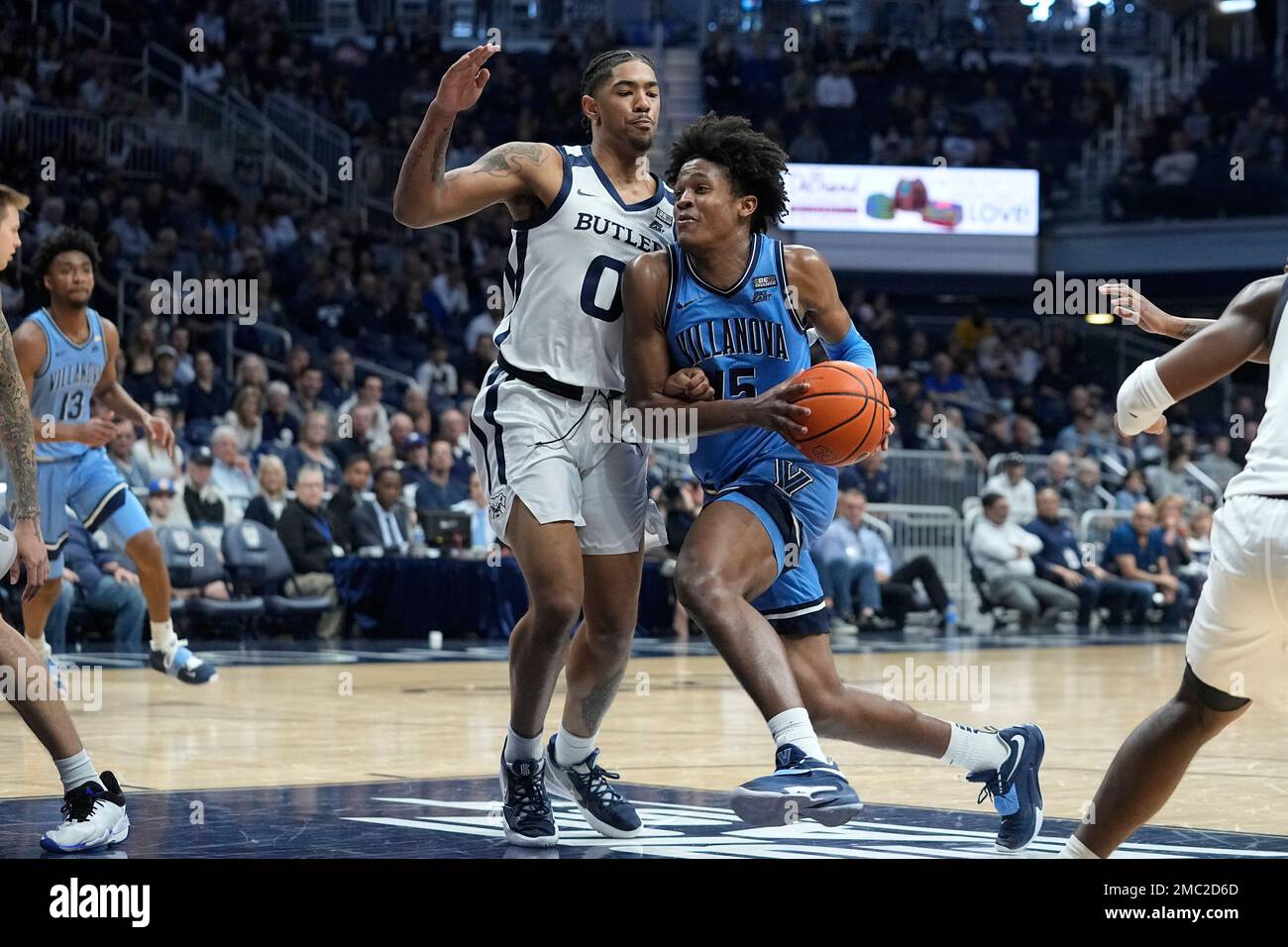 Villanova guard Jordan Longino (15) drives to the basket past Butler forward D.J. Hughes (0 ...