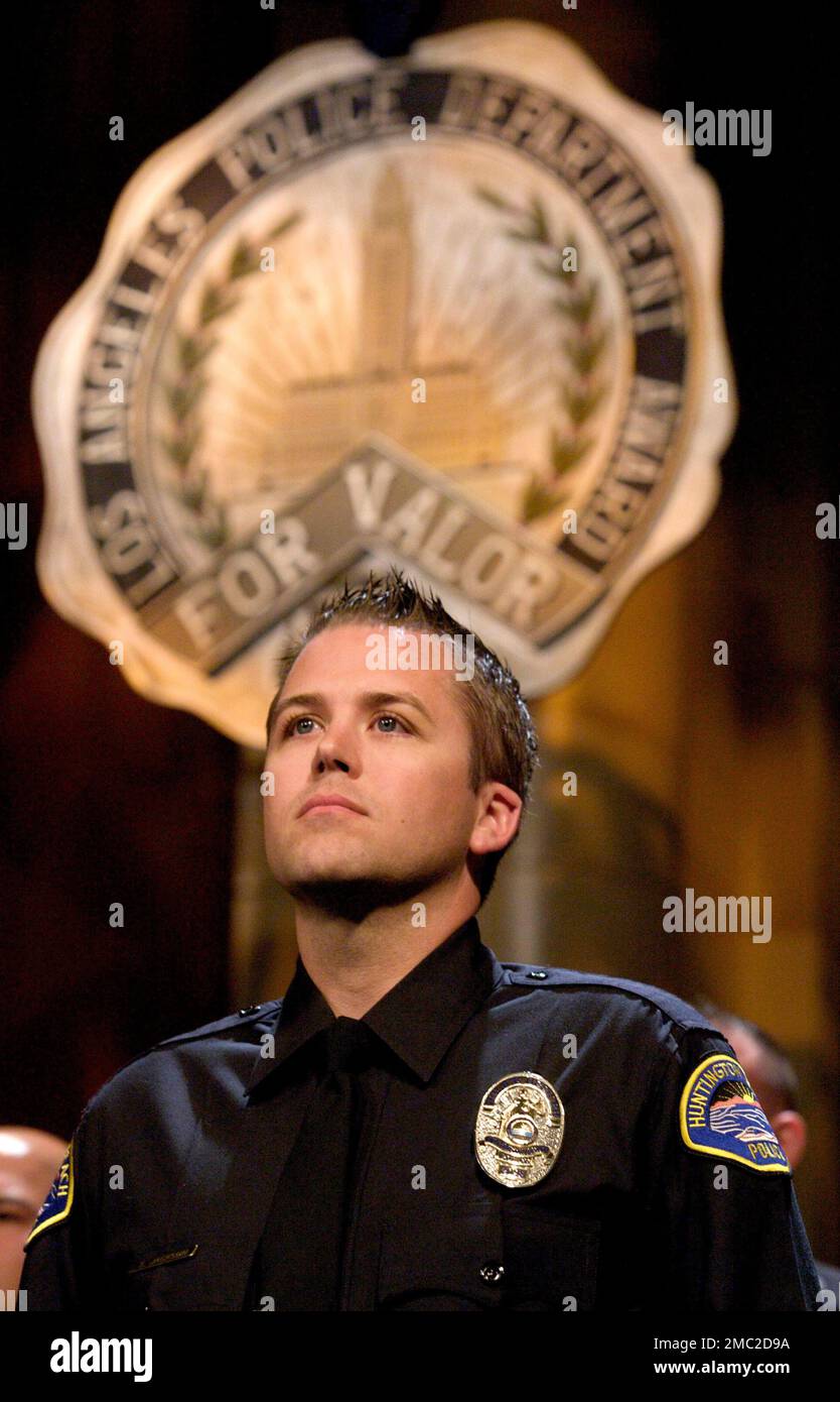 FILE - Huntington Beach police officer Trevor Jackson is awarded the ...