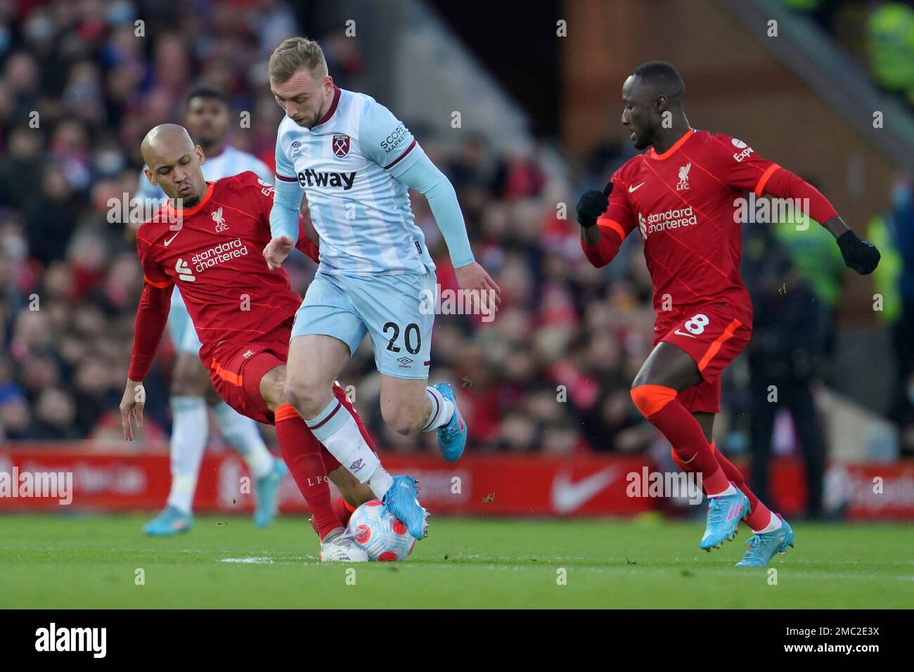 West Ham's Jarrod Bowen, center, fights to take control of the ball ...