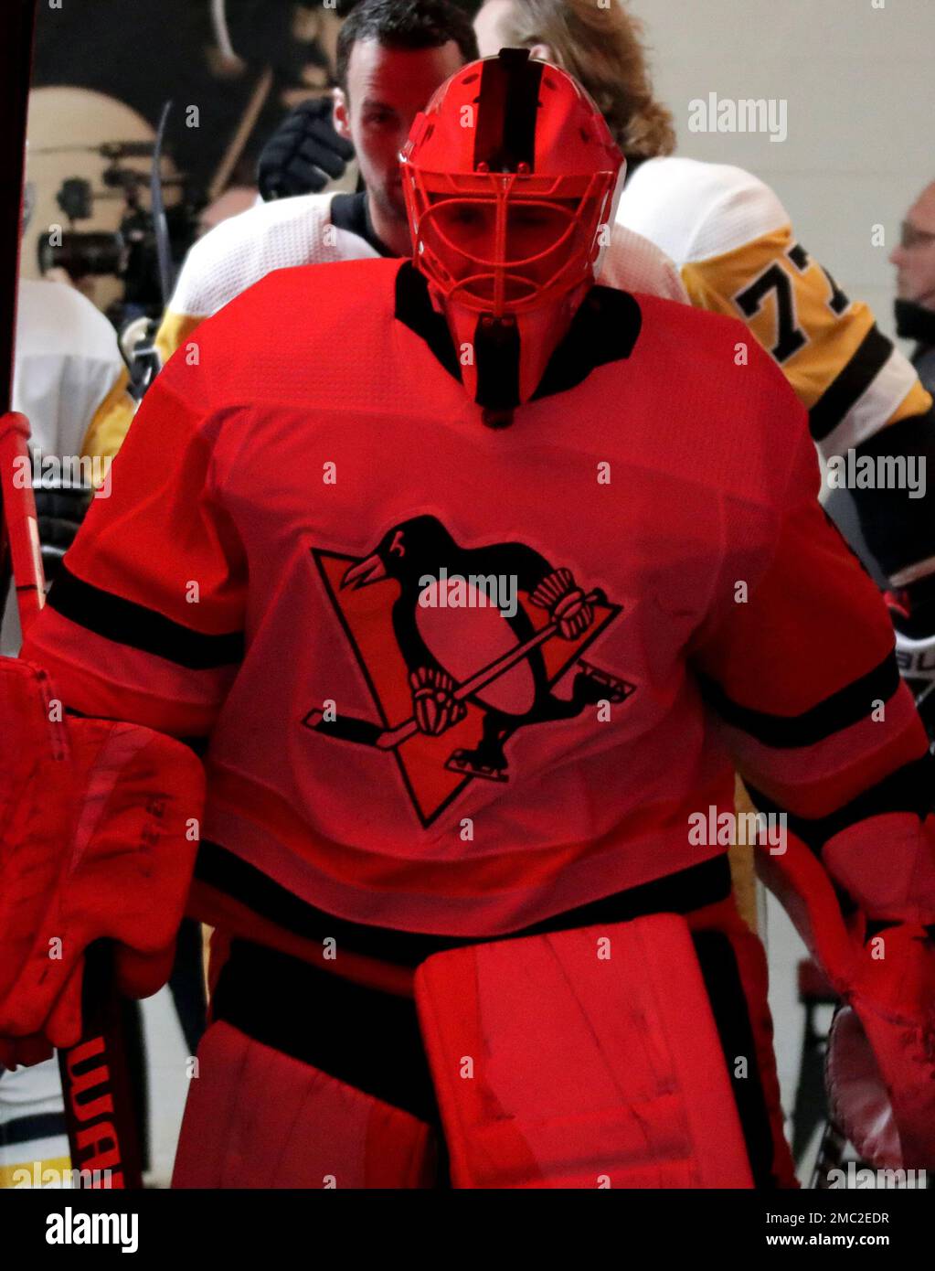 Pittsburgh Penguins goaltender Casey DeSmith (1) leads the team down ...
