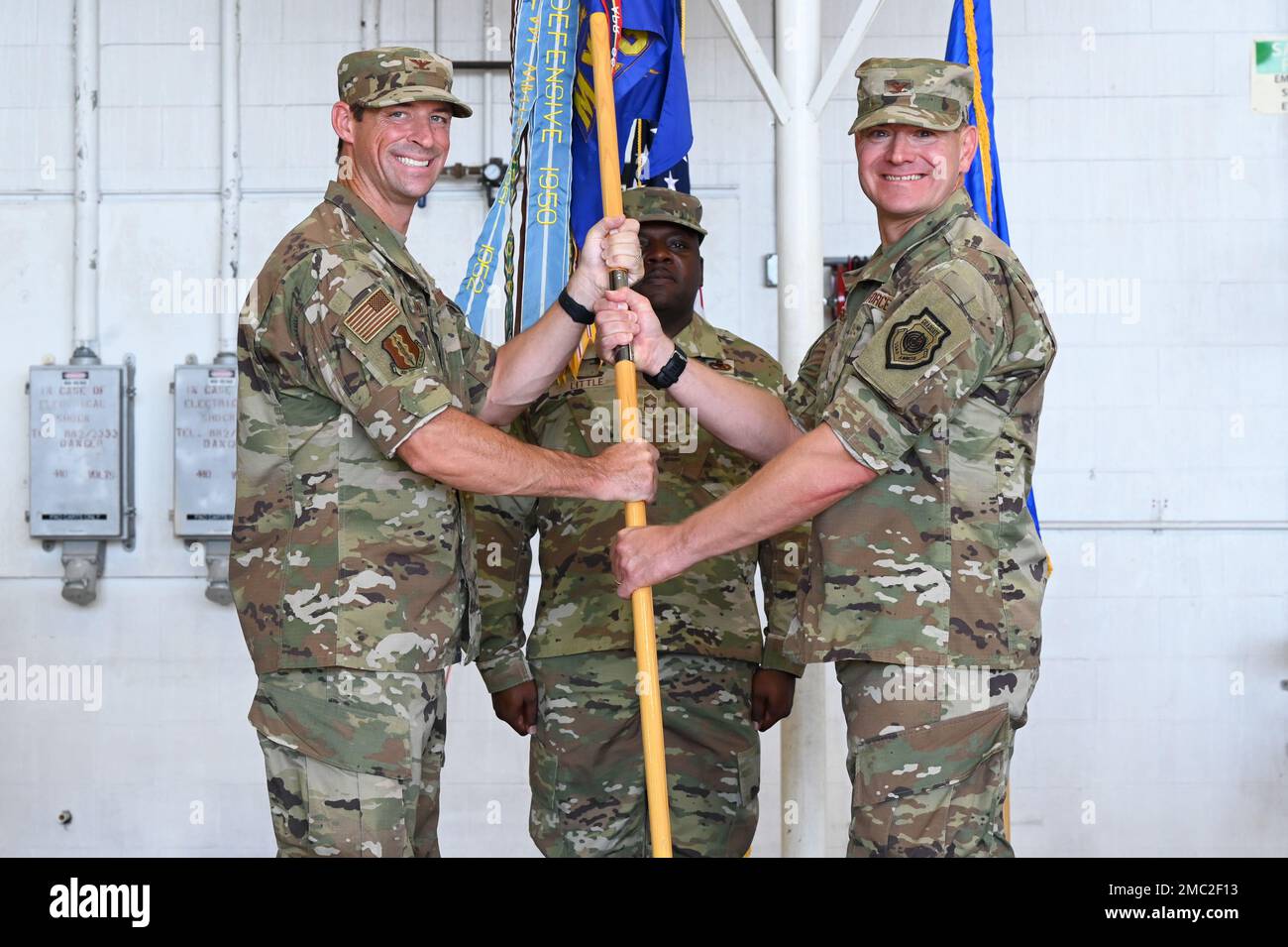U.S. Air Force Col. Thomas Preston, right, incoming commander, assumes ...
