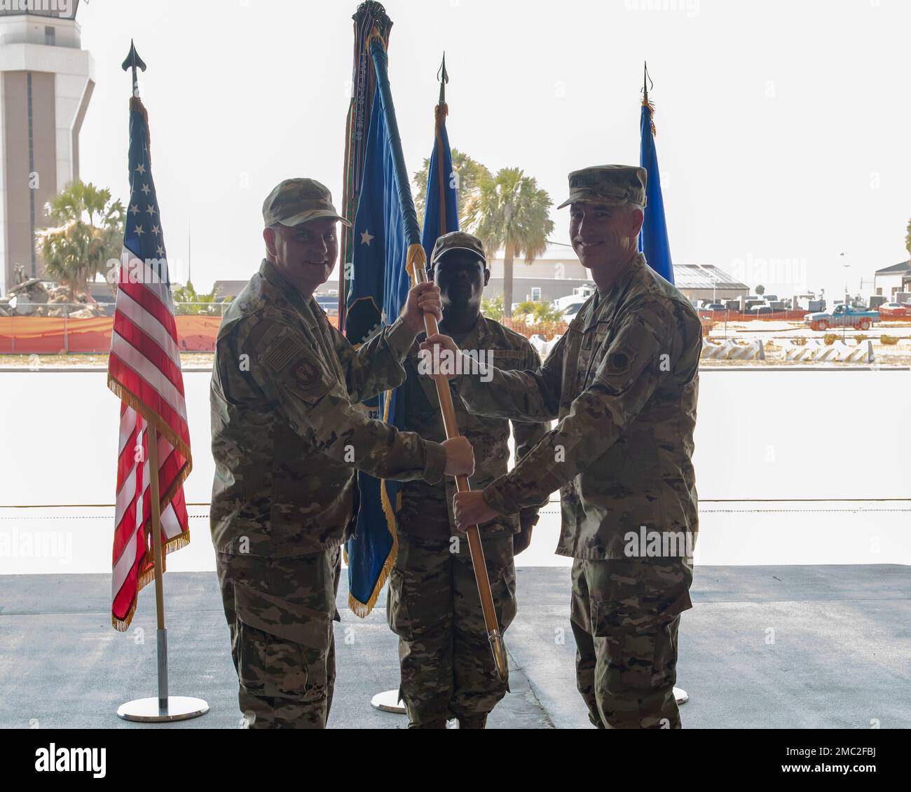 U.S. Air Force Col. George Watkins, right, assumes command of the 325th ...