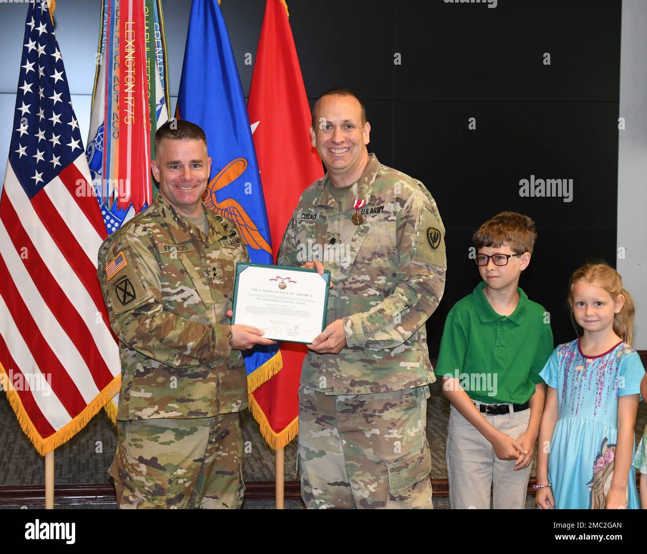 Lt. Col. Michael C. Cusack, staff judge advocate, stands with his ...