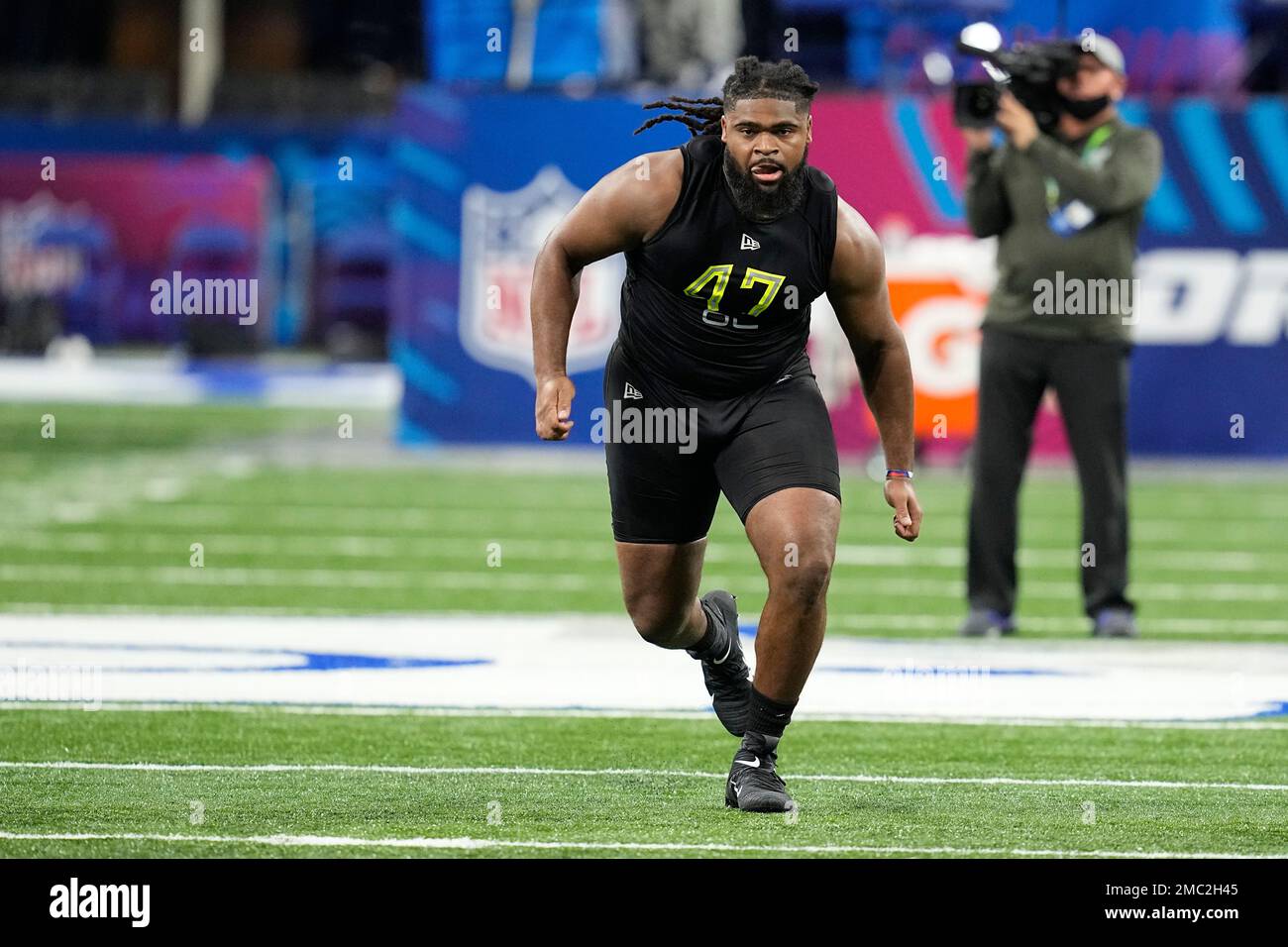 Virginia Tech offensive lineman Lecitus Smith runs a drill during the ...