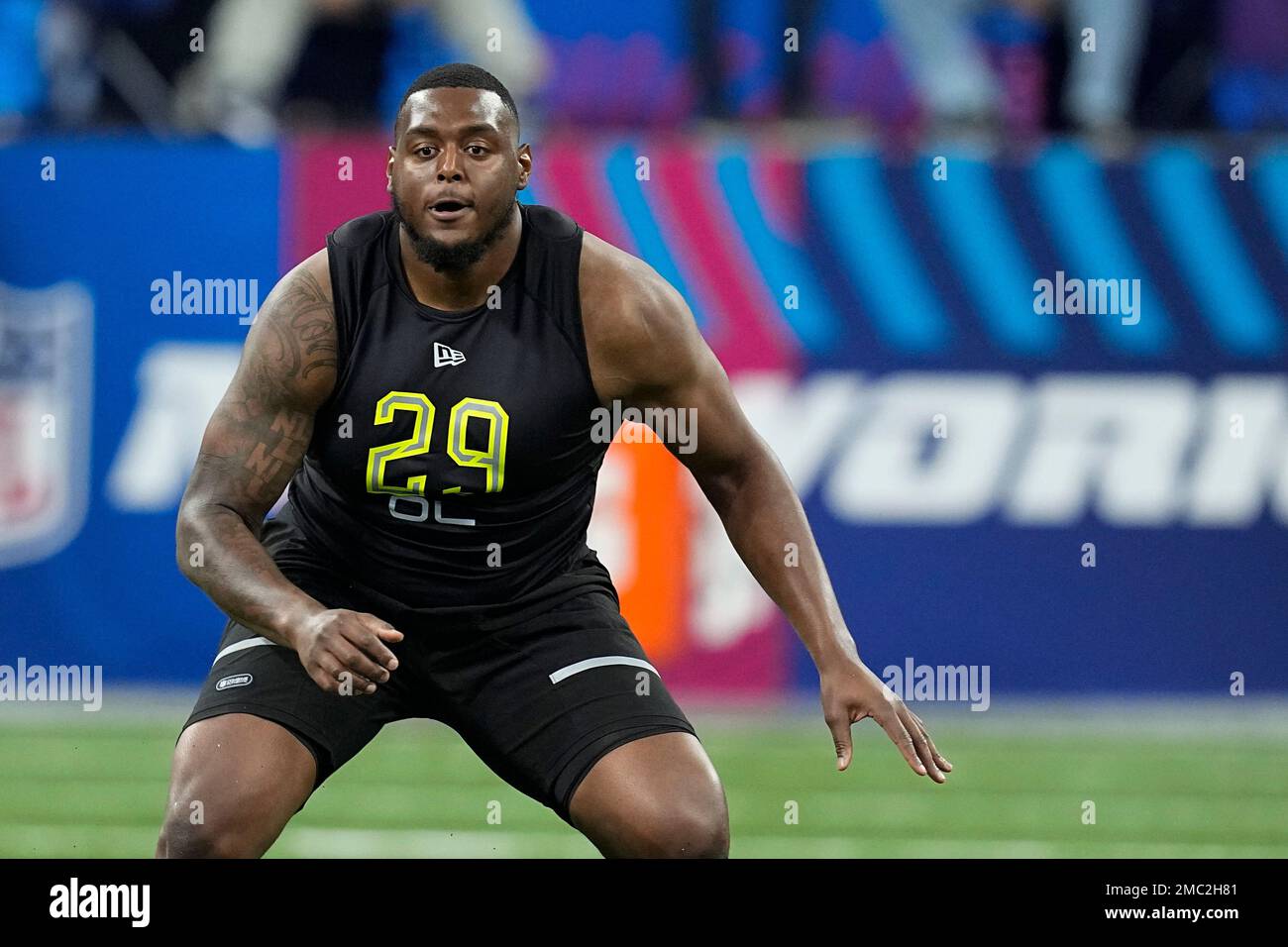 Illinois offensive lineman Vederian Lowe runs a drill during the NFL ...