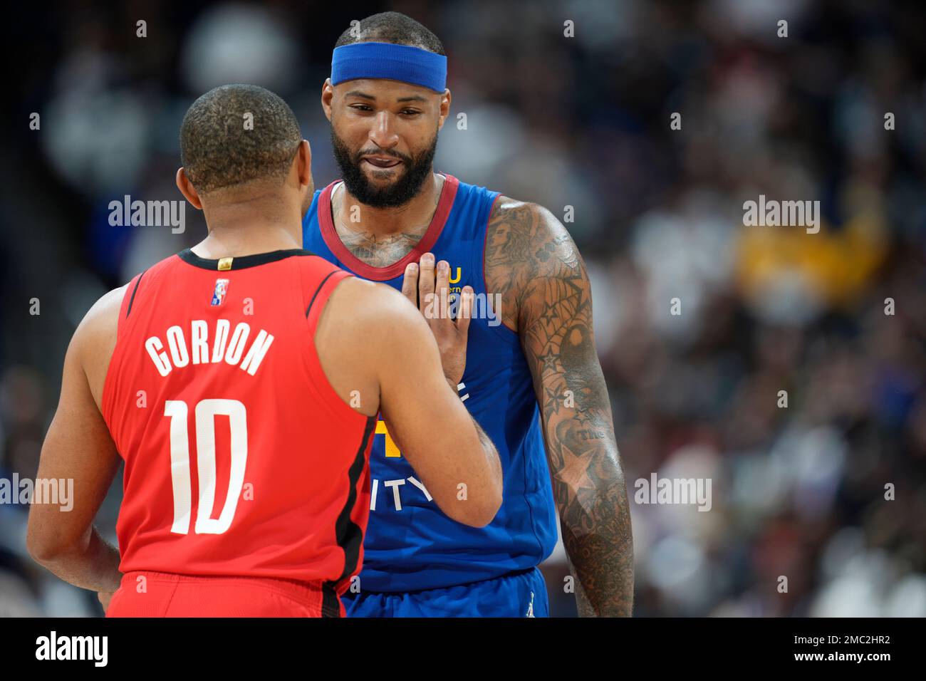 Houston Rockets guard Eric Gordon, front, chats with Denver Nuggets ...