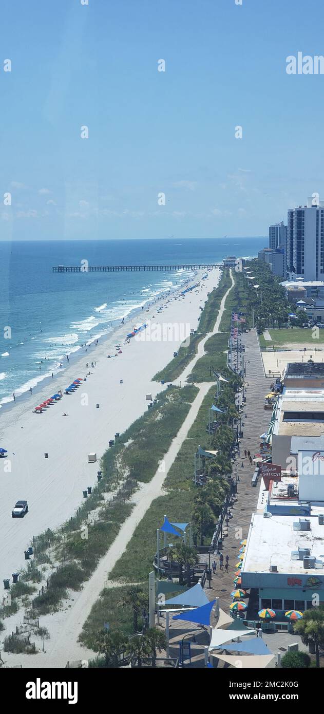 The city buildings near the ocean on a sunny day Stock Photo - Alamy