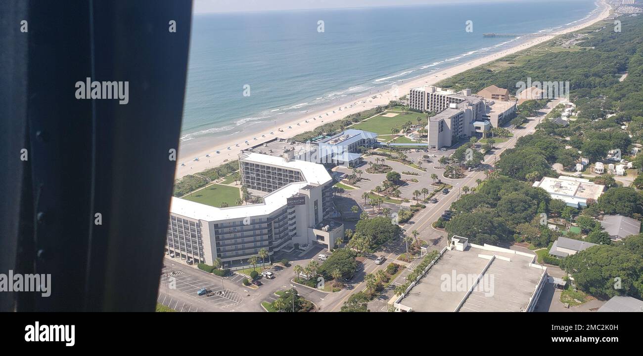 The city buildings near the ocean on a sunny day Stock Photo - Alamy