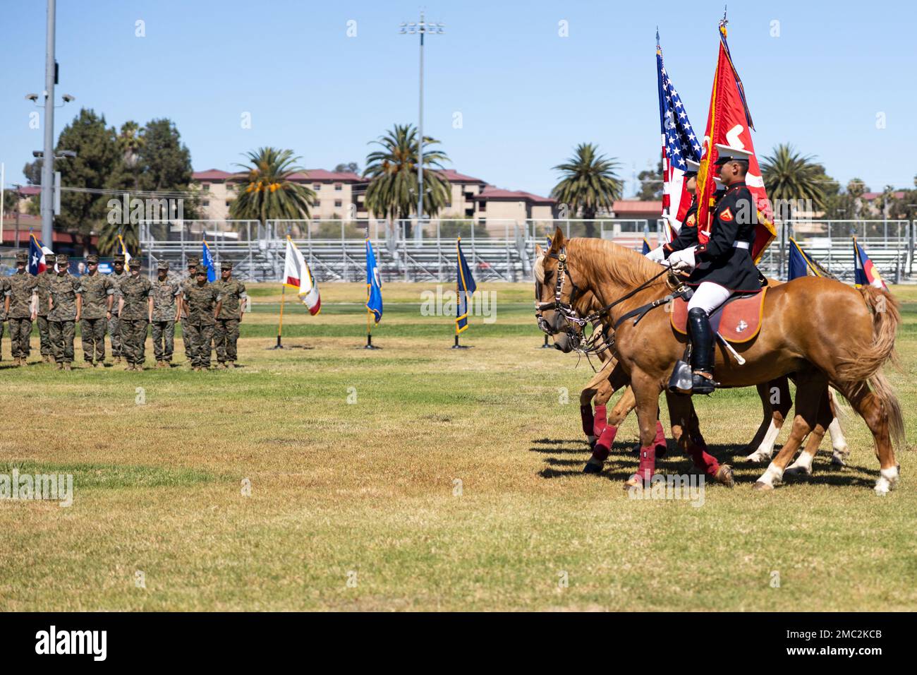 U.S. Marines from the Marine Corps Mounted Color Guard present the ...