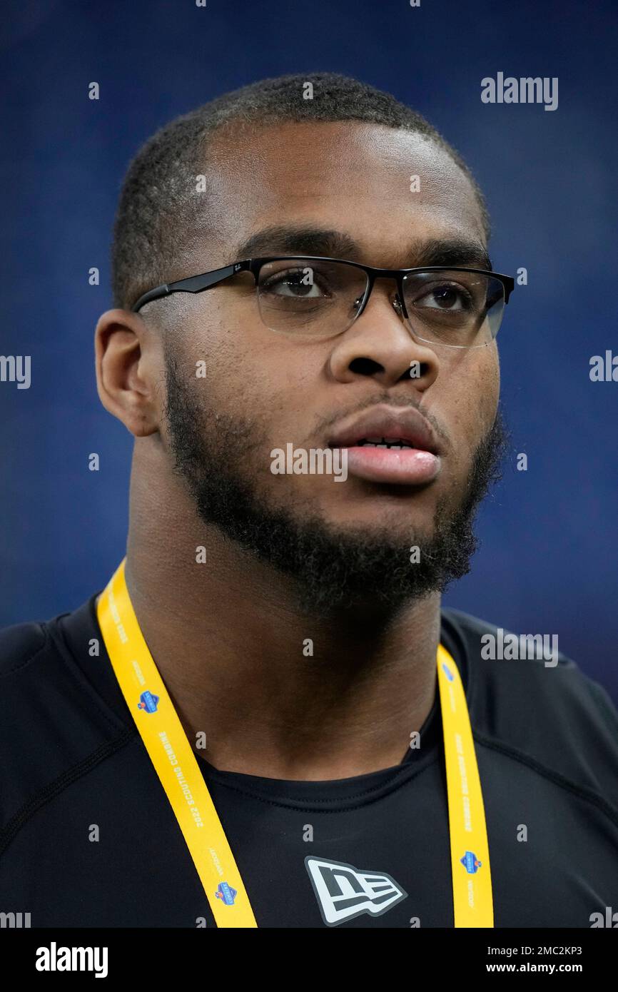 Alabama offensive lineman Evan Neal watches a drill at the NFL football ...