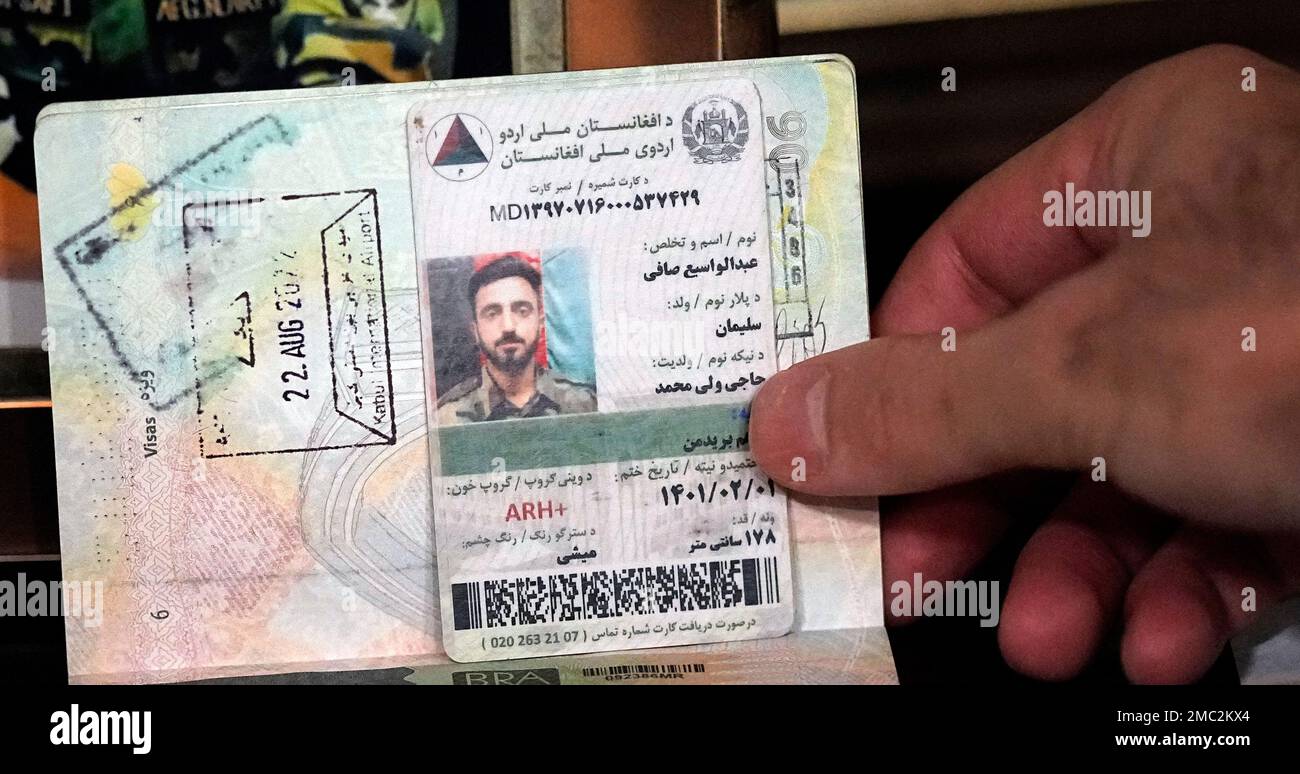 Sami-ullah Safi holds his brother's, Adbul Wasi Safi, military ...