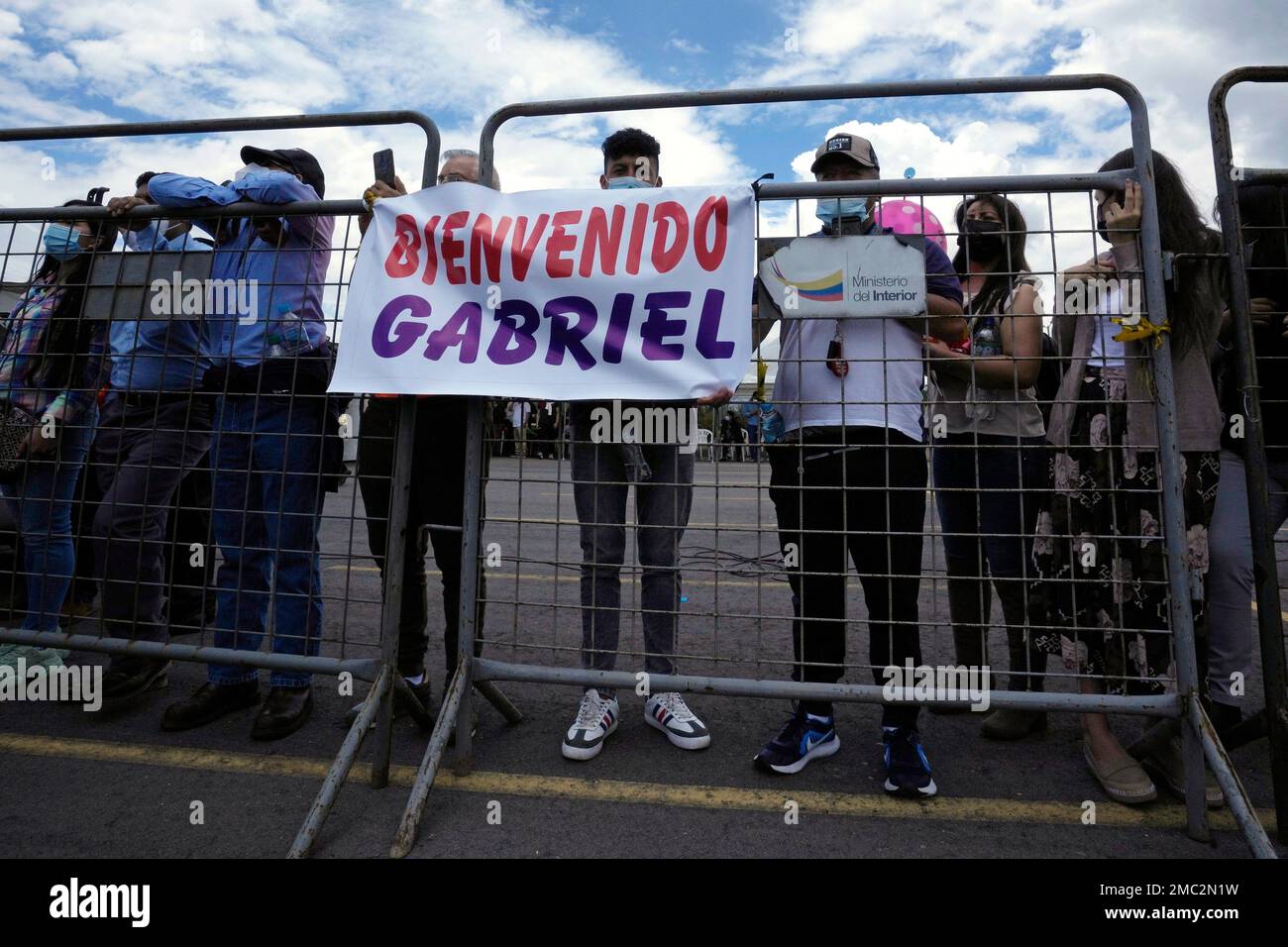 The Spanish sign "Welcome Gabriel" hangs where people wait for ...