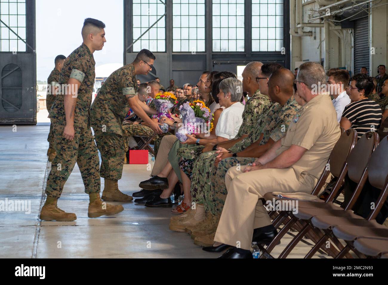 U.S. Marines present flowers to the families of U.S. Marine Corps Lt ...