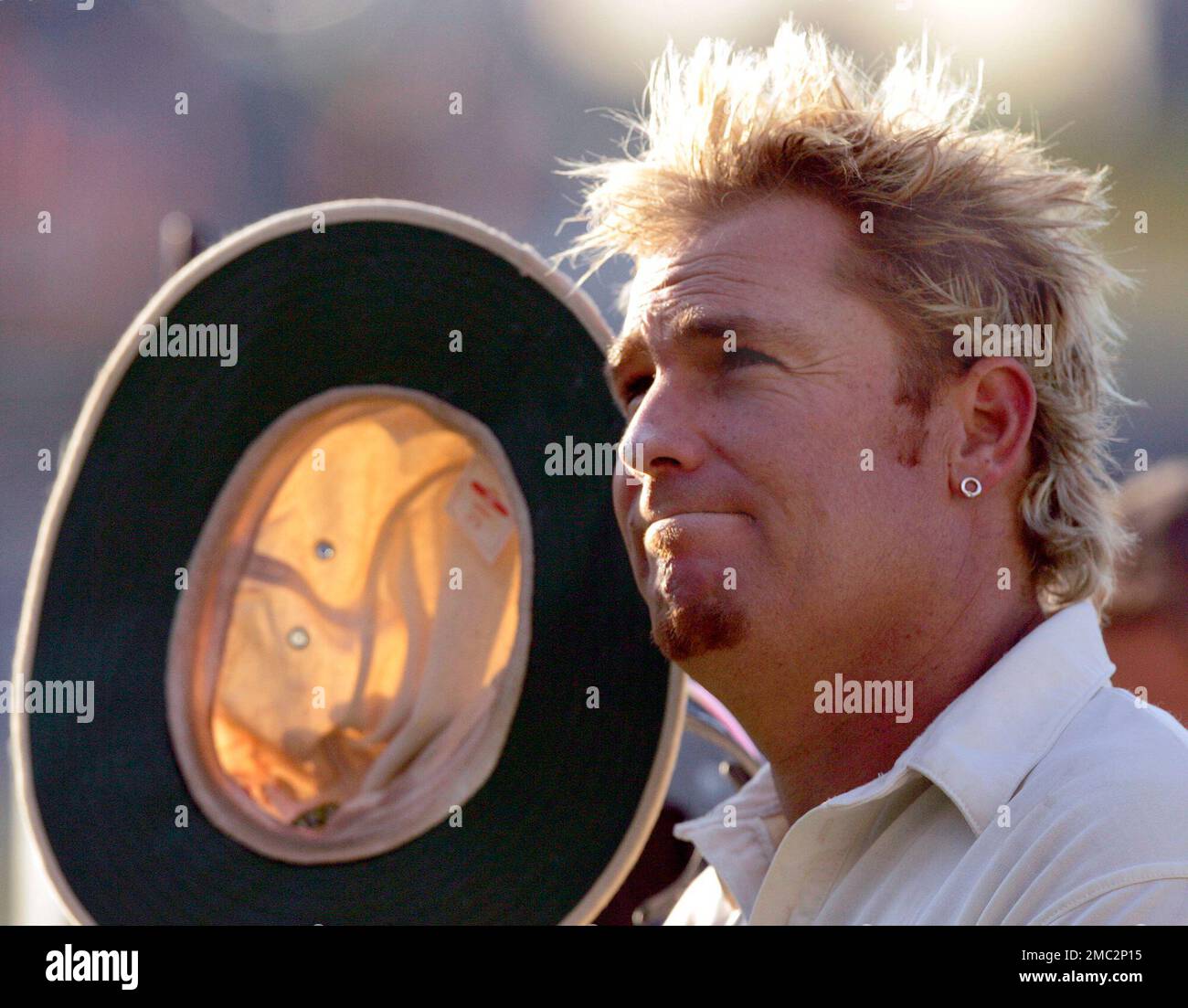 FILE - Australia's Shane Warne leaves the field after taking 5 wickets ...
