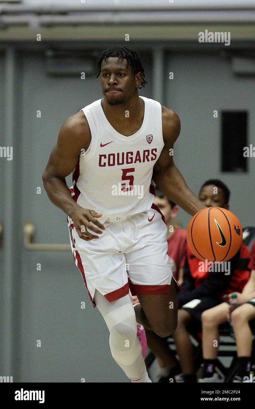 Washington State guard TJ Bamba controls the ball during the second ...