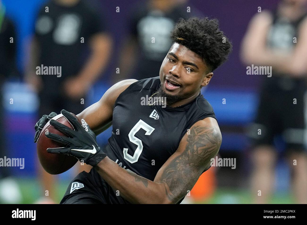 Arkansas wide receiver Treylon Burks runs a drill during the NFL ...