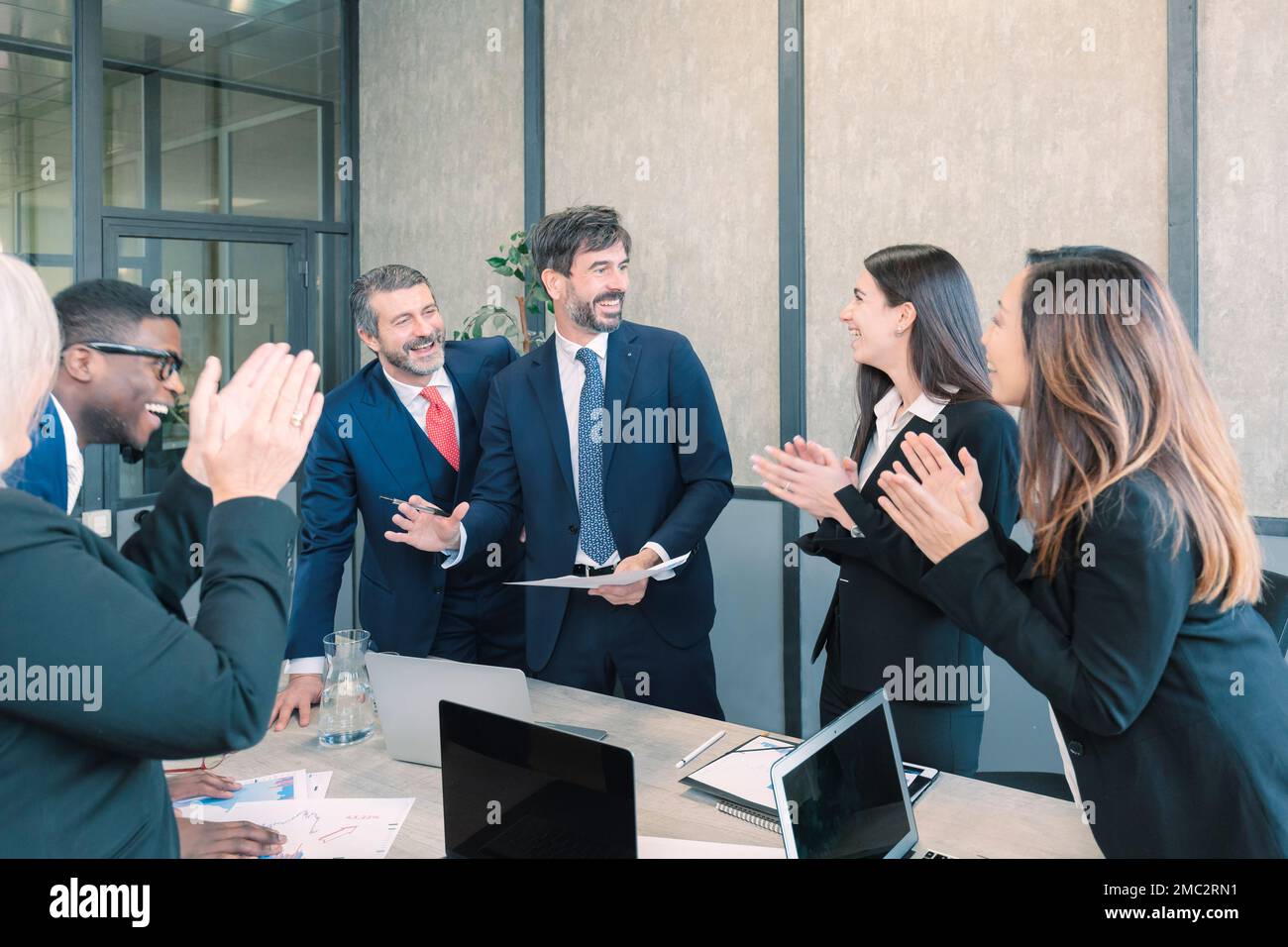 Group of multiethnic workers smiling happy and confident. Working ...