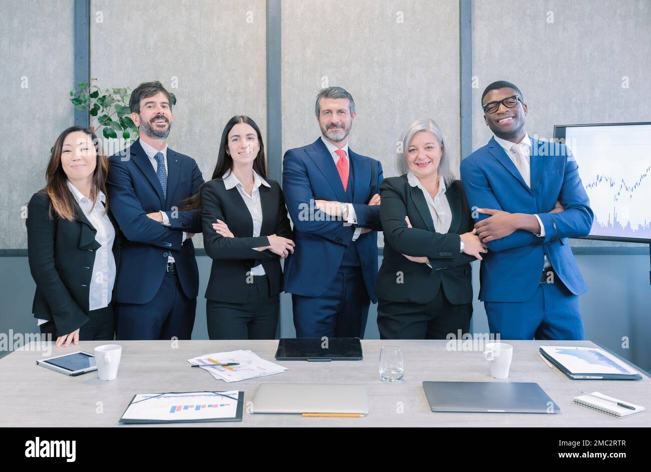 Diverse team of happy young people standing together. Multi-ethnic ...