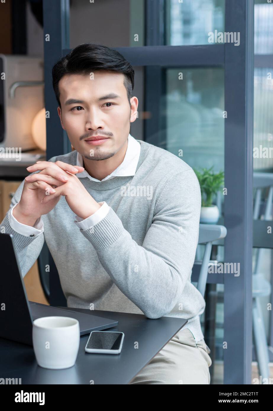 Young men who use a computer Stock Photo - Alamy