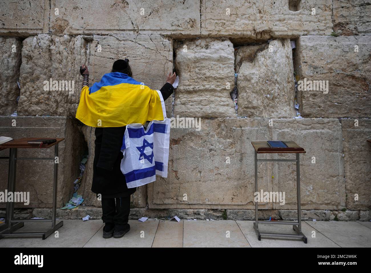 An ultra-Orthodox Jewish man wrapped in Ukrainian and Israeli national ...