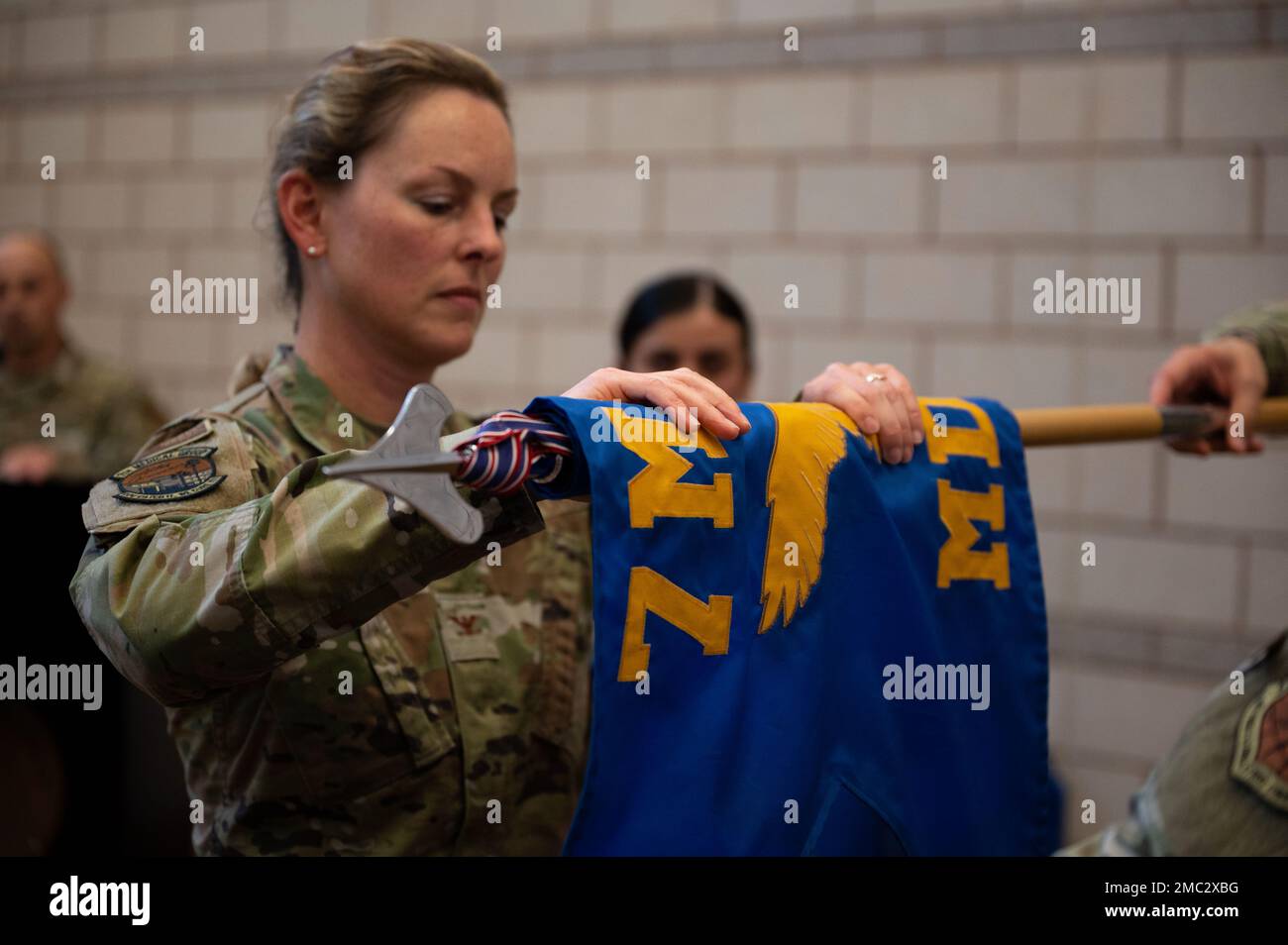 Col. Elizabeth Somsel, 7th Medical Group commander, cases the colors of ...