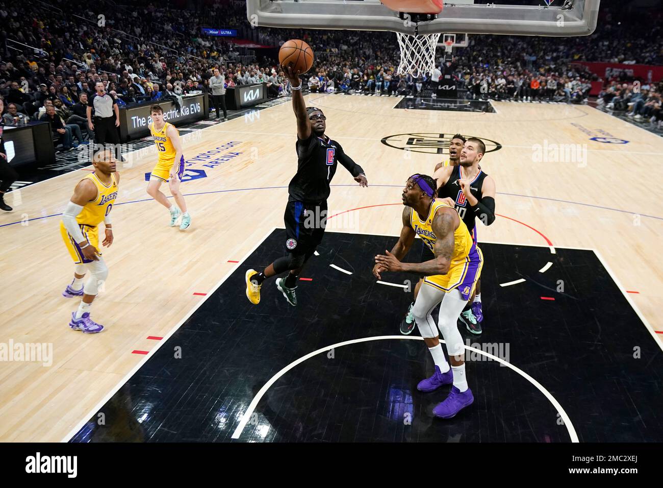 Los Angeles Clippers guard Reggie Jackson, center left, scores over Los ...