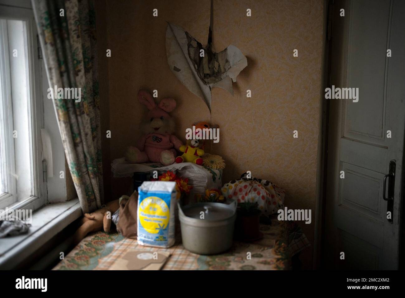 A wall damaged by Russian fire during the Russian occupation is ...