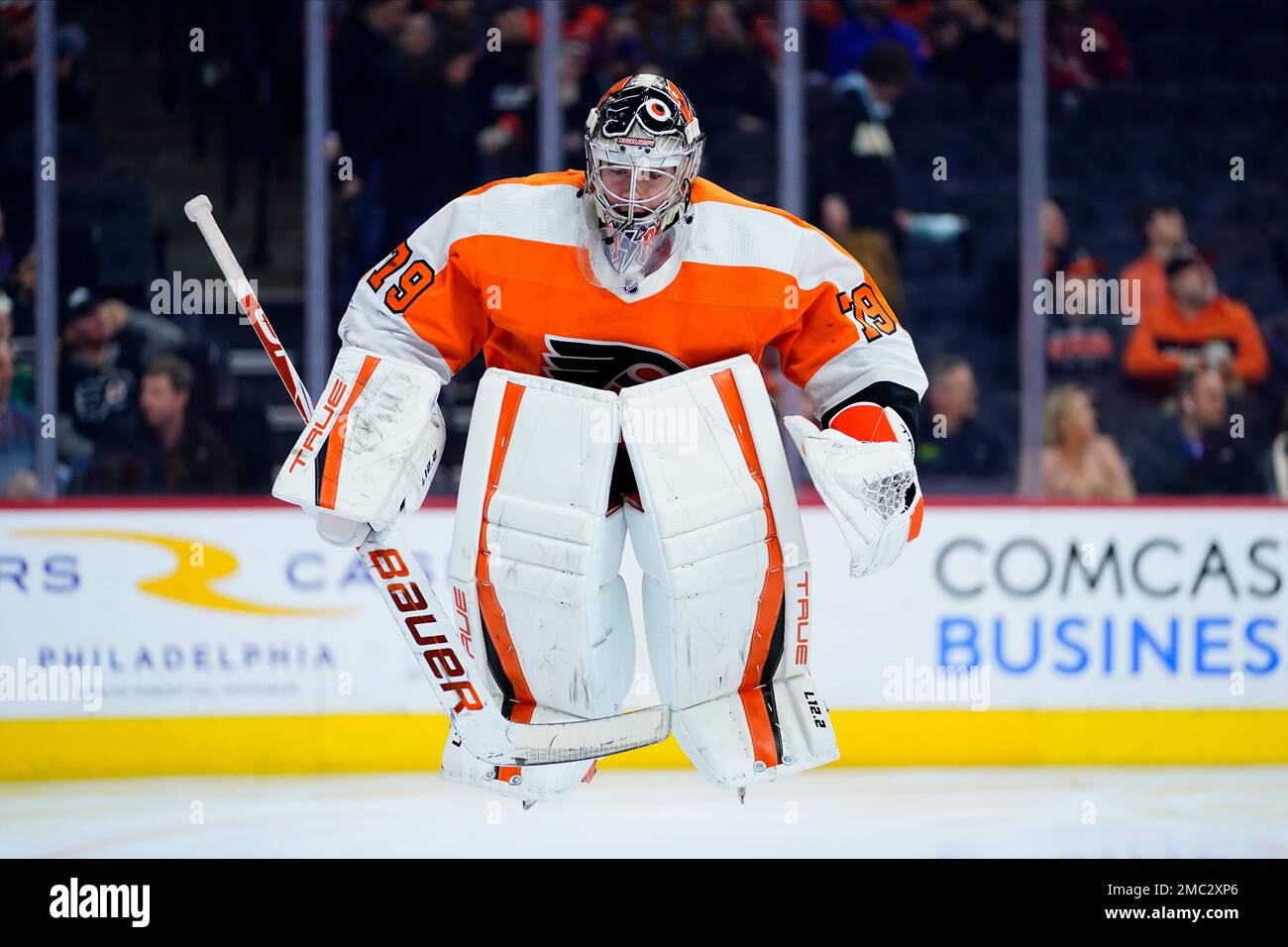 Philadelphia Flyers' Carter Hart stretches during an NHL hockey game ...