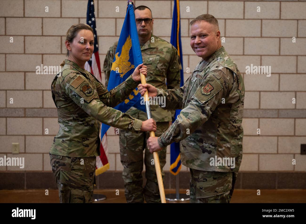 Col. Elizabeth Somsel, 7th Medical Group commander, takes the guidon ...