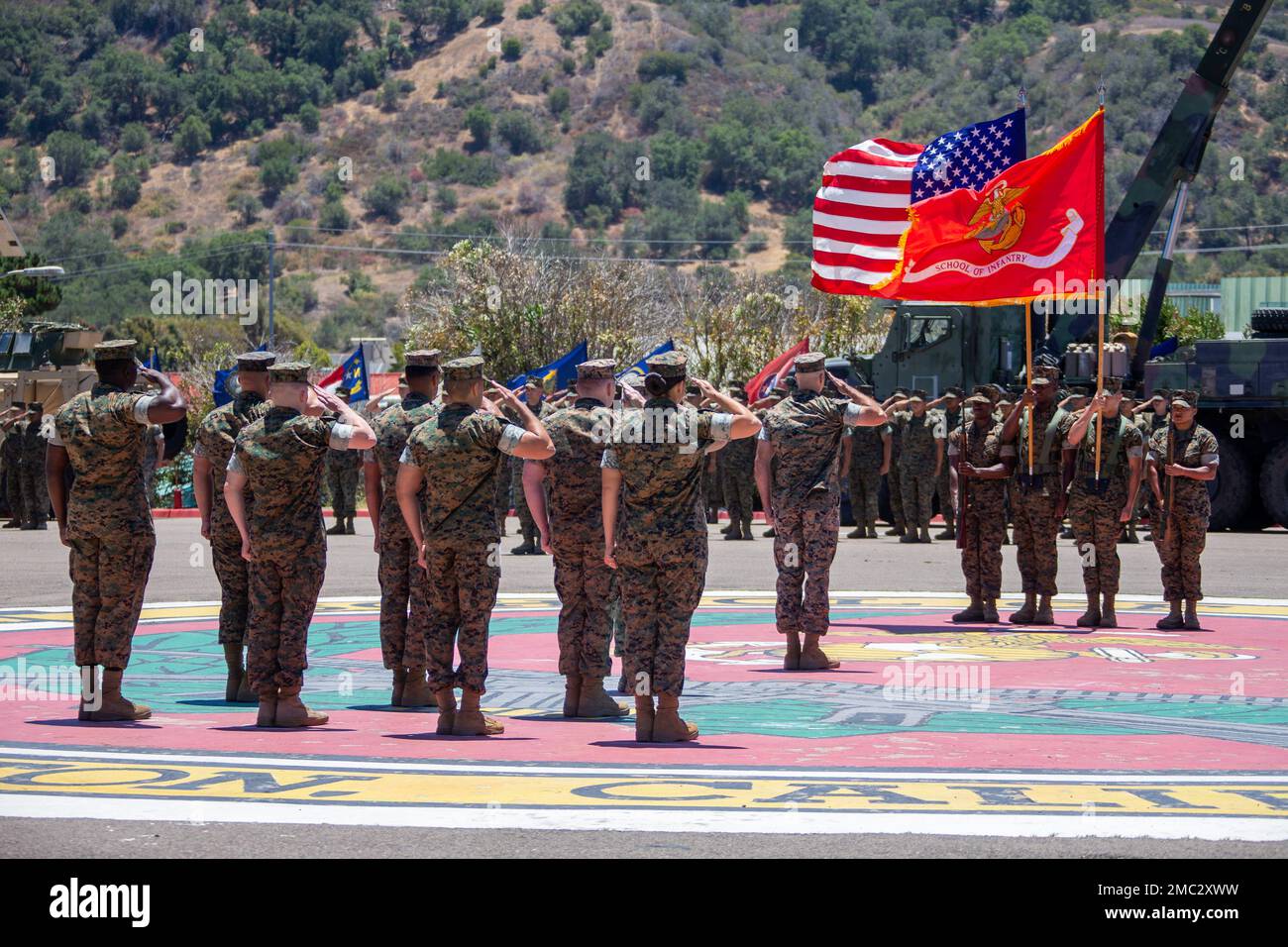 U.S. Marines with the School of Infantry - West, salute the colors ...