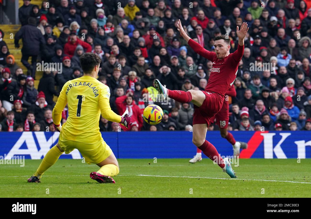 Chelsea goalkeeper Kepa Arrizabalaga saves at the feet of Liverpool's ...