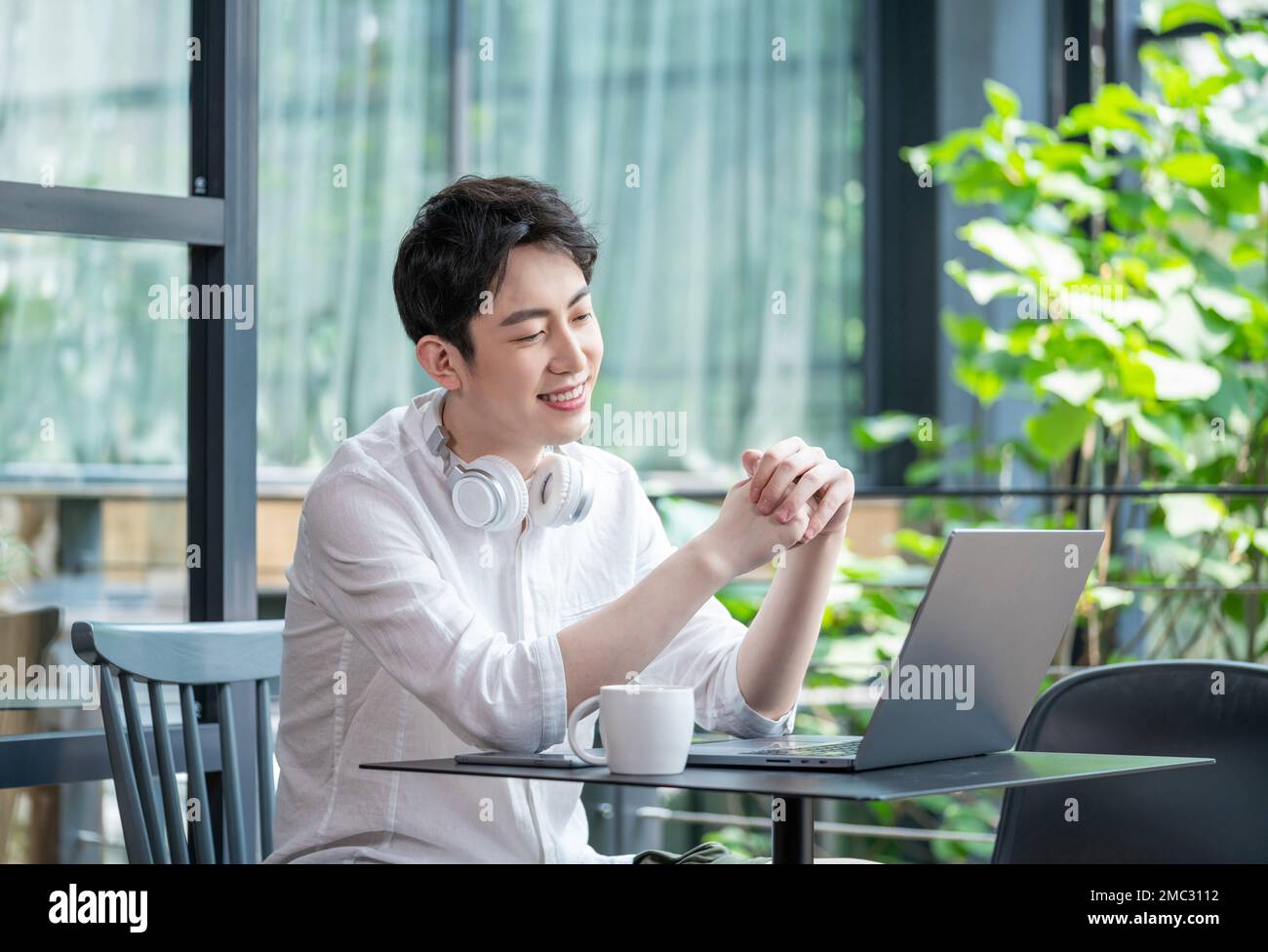 Young men who use a computer Stock Photo - Alamy