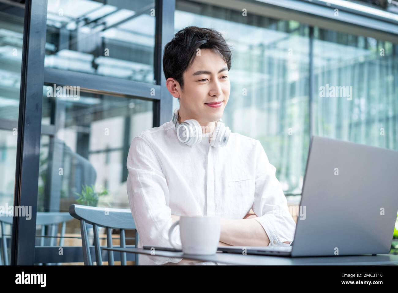 Young men who use a computer Stock Photo - Alamy