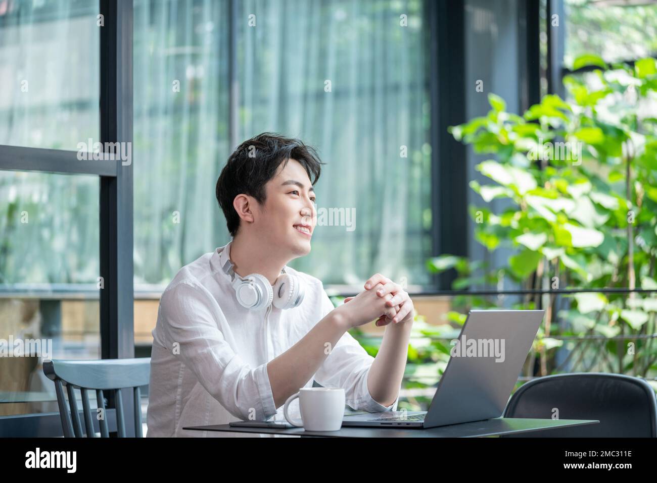 Young men who use a computer Stock Photo - Alamy