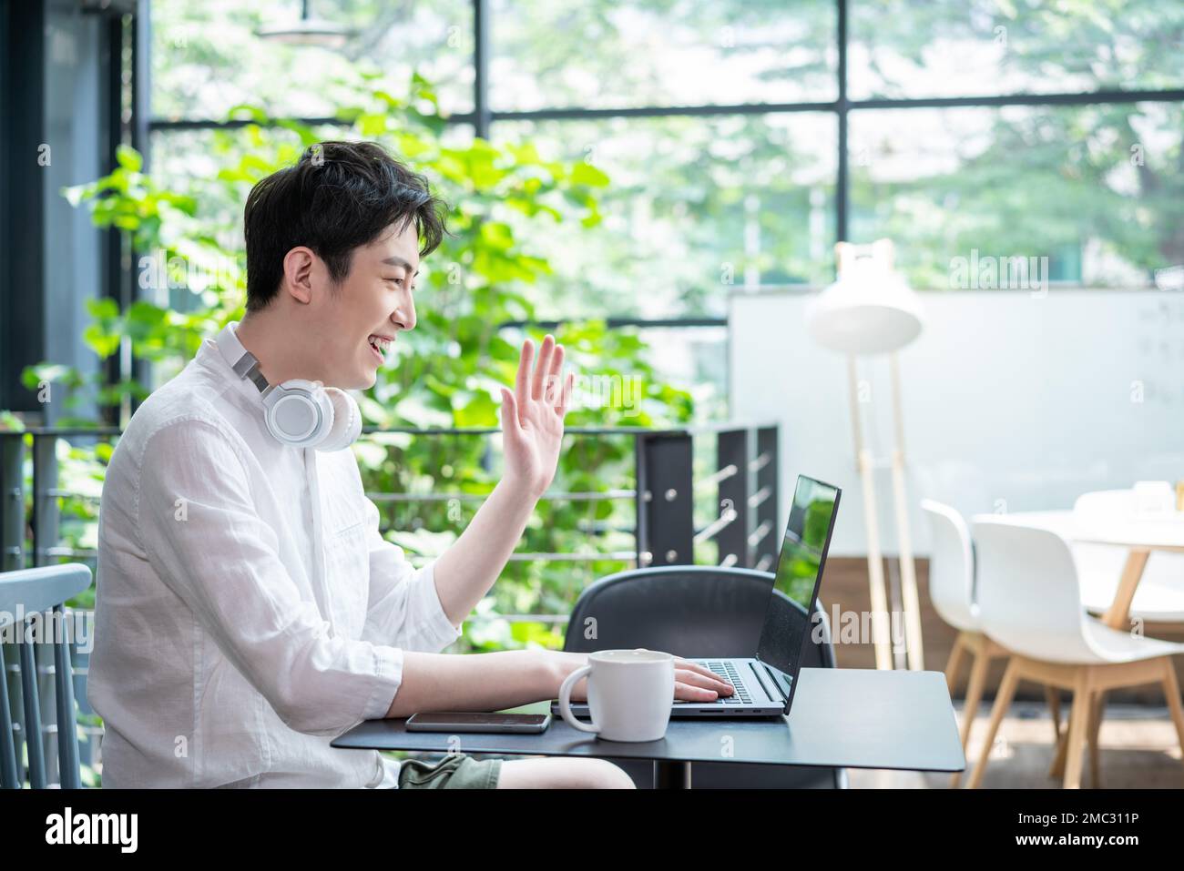 Young men who use a computer Stock Photo - Alamy