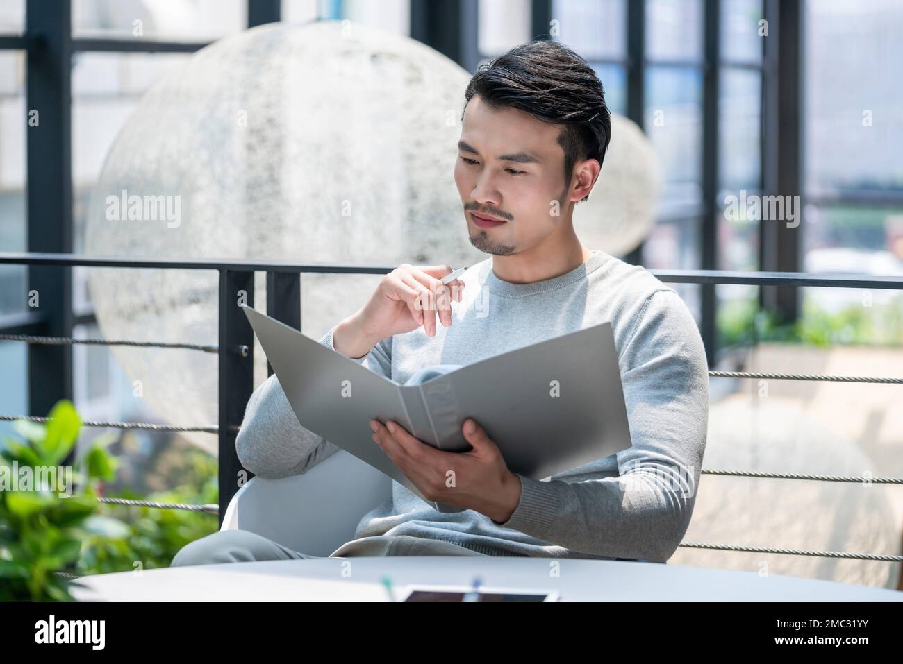 A young business man at work Stock Photo - Alamy