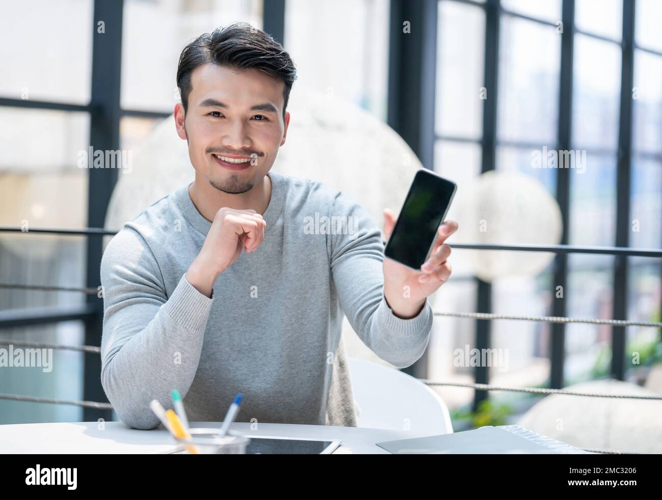 A young business man at work Stock Photo - Alamy